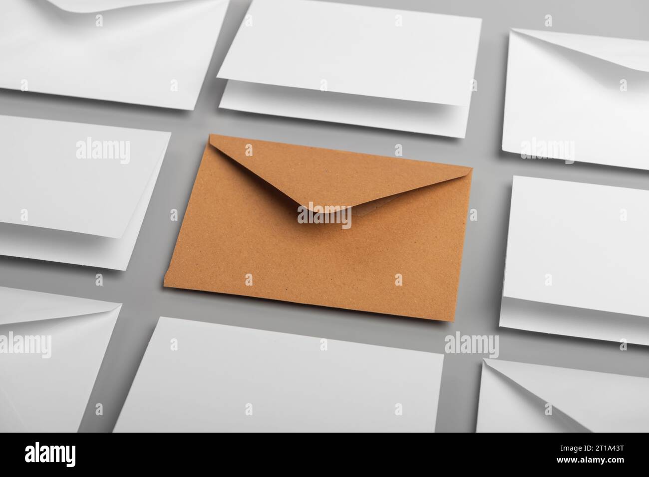 White envelopes and postcards and one craft envelope on the table Stock ...