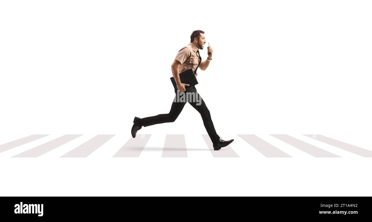 Full length profile shot of a security guard running at a pedestrian ...