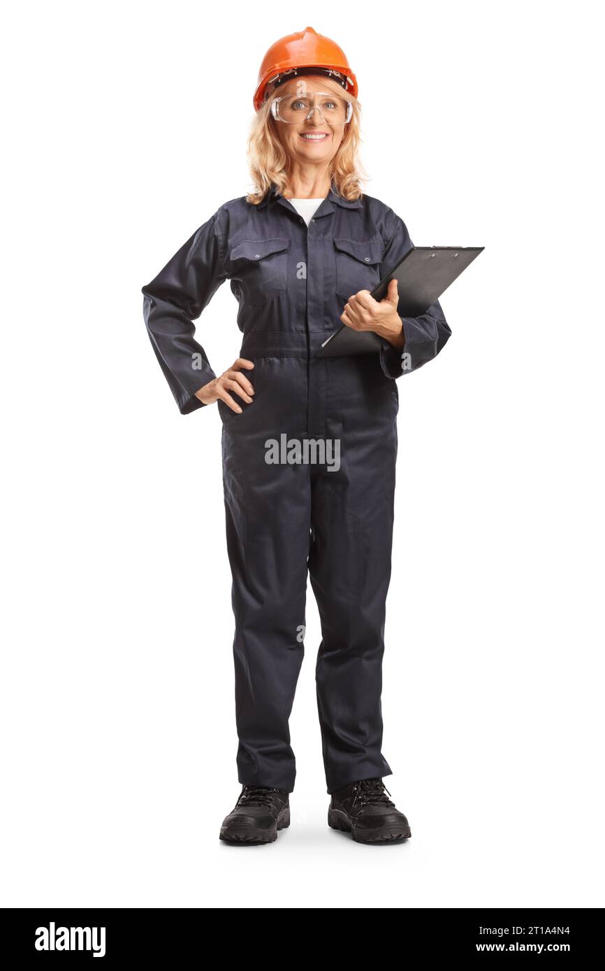 Female factory worker in a uniform wearing helmet and goggles and ...