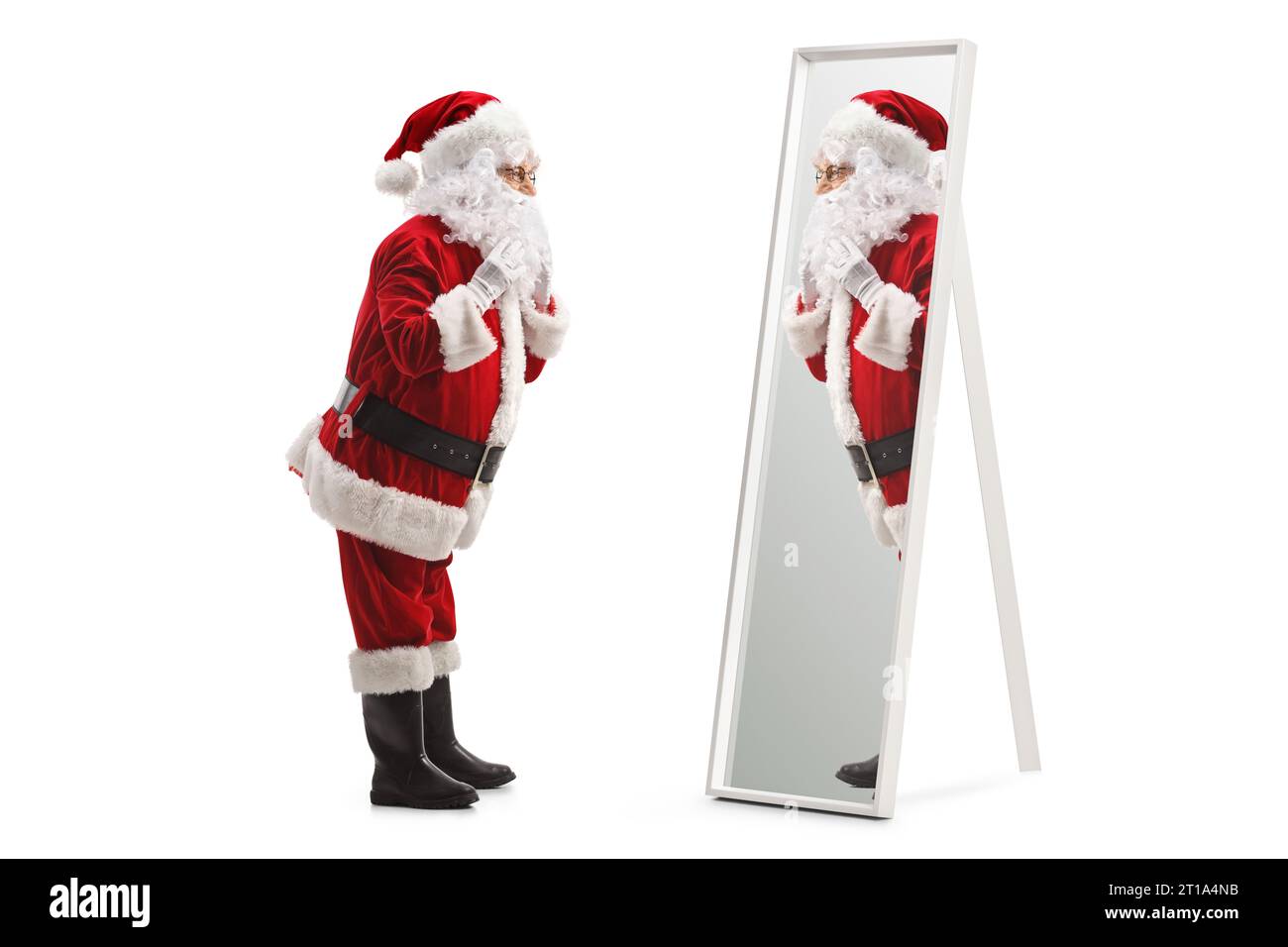 Full length profile shot of santa claus getting ready and looking at a ...