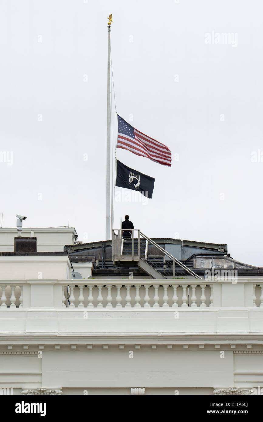 The flag above the White House flies at half staff in honor of Senator ...