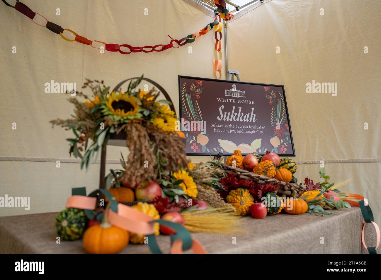 White Houses staff and their families decorate a sukkah in honor of the ...
