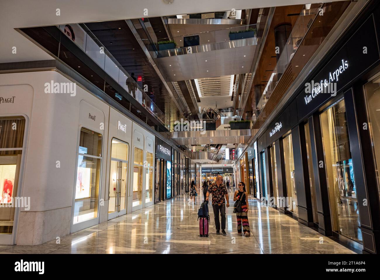 High end mall scene with shoppers walking around window shopping Stock ...