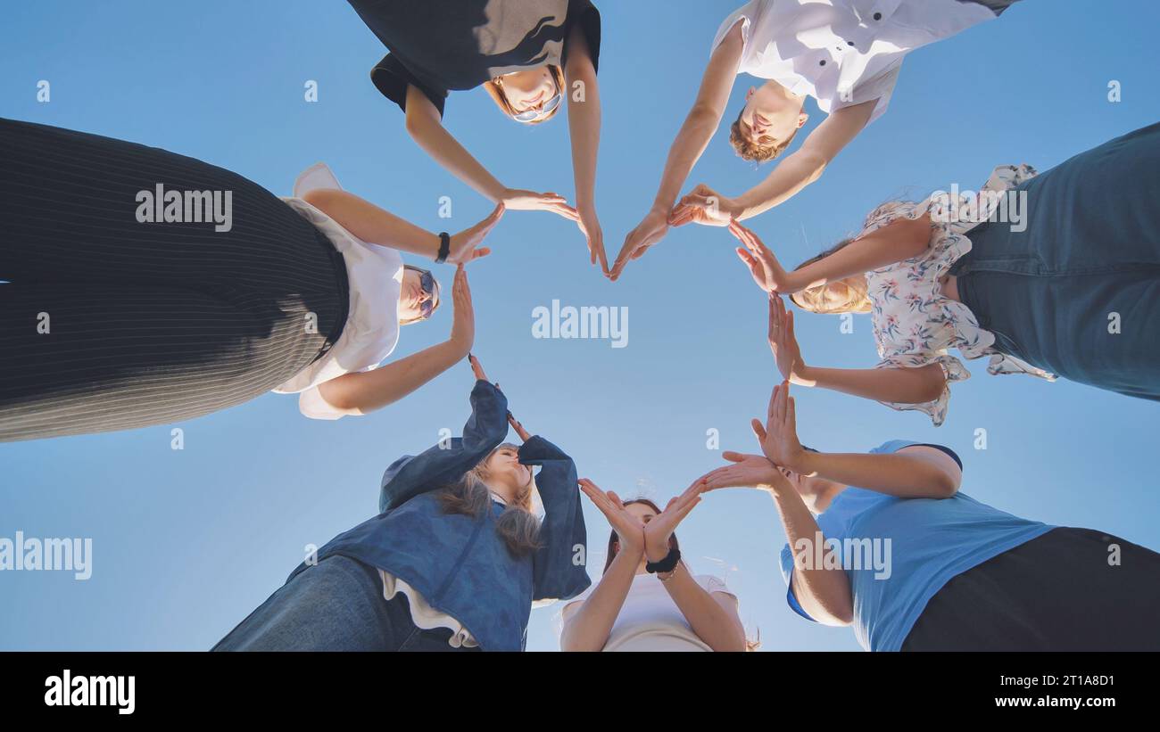 School children make a heart shape from their hands Stock Photo - Alamy