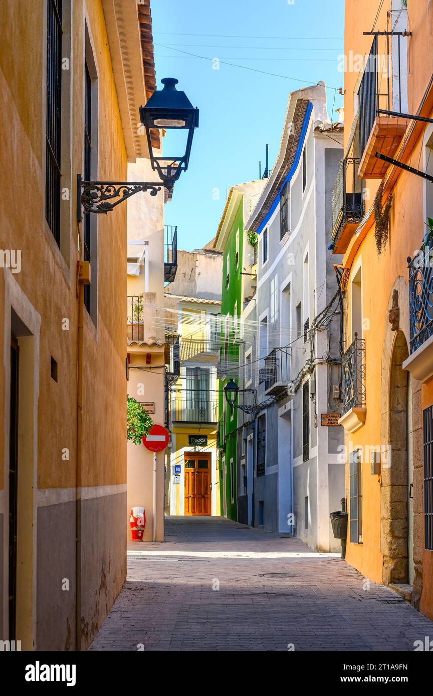 Narrow city street with the traditional architecture of buildings. The ...