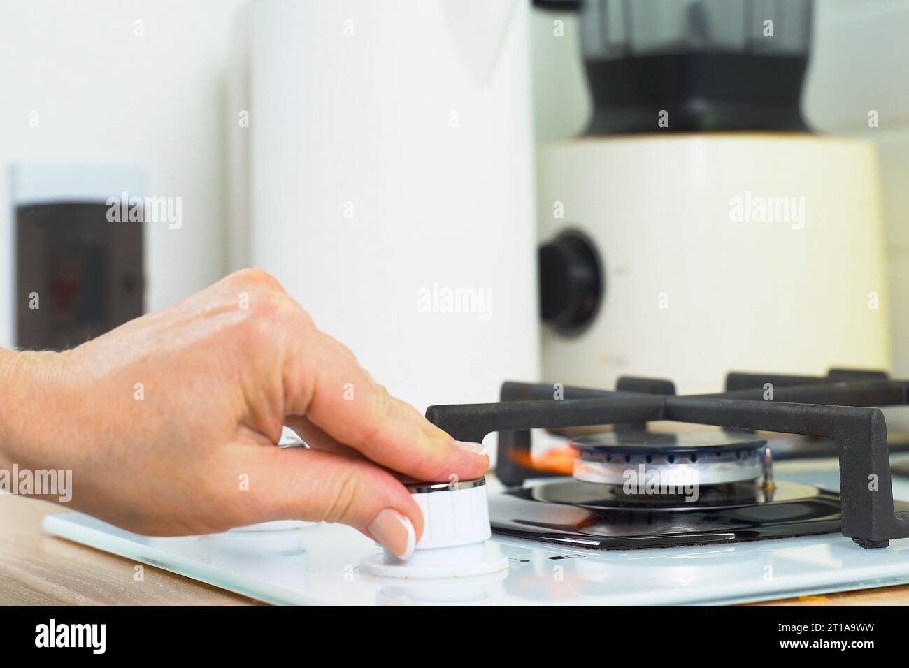 Woman gas hob hi-res stock photography and images - Alamy