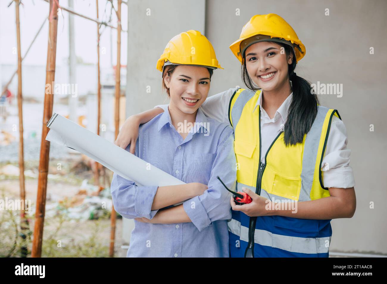 Portrait happy smiling construction Engineer women working team together builder architect ...