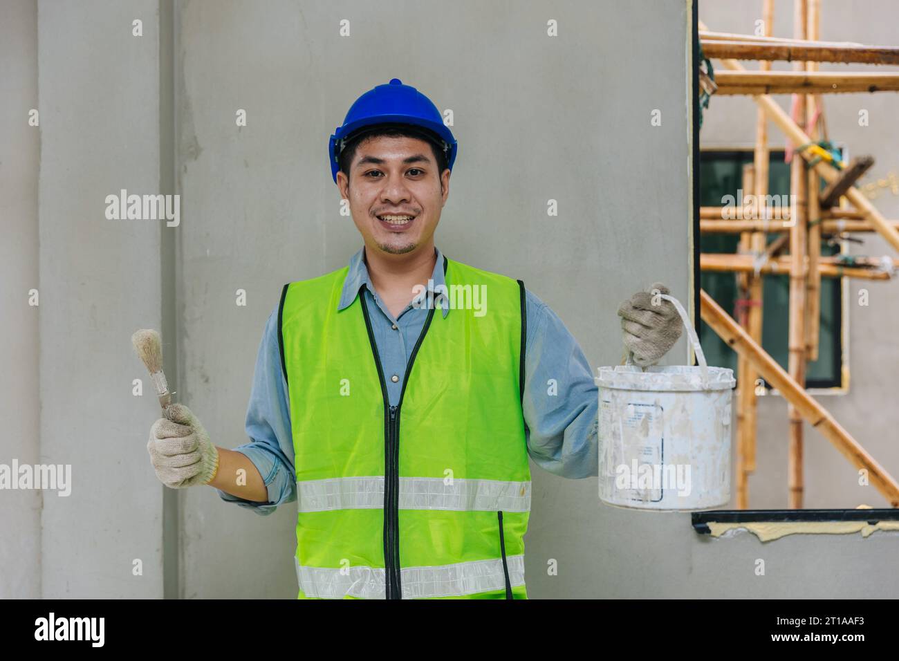 Portrait painter happy worker hand holding painting brush and color ...