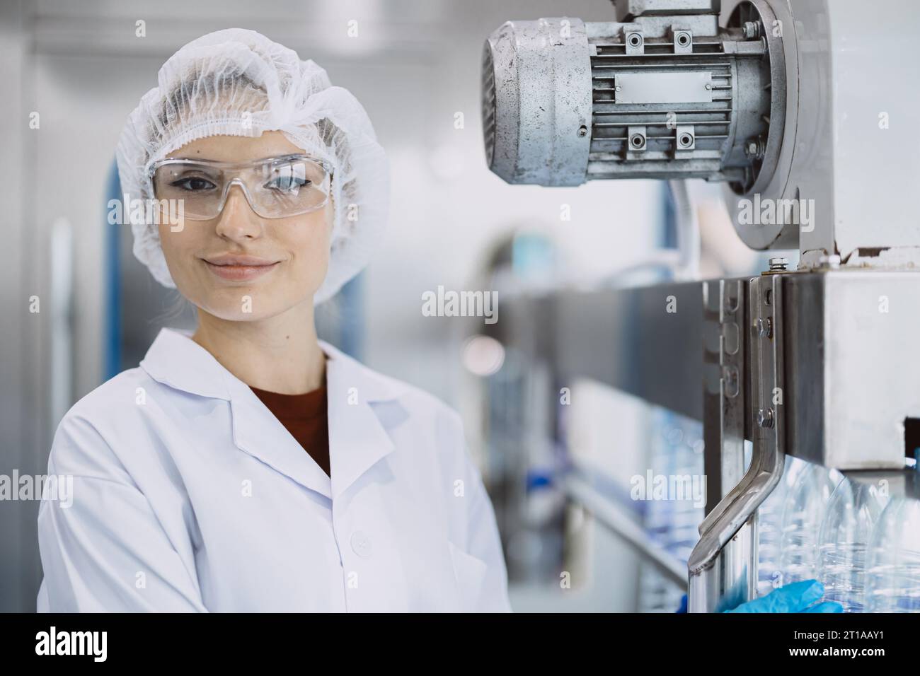 portrait happy women worker working in hygiene factory in clean line ...
