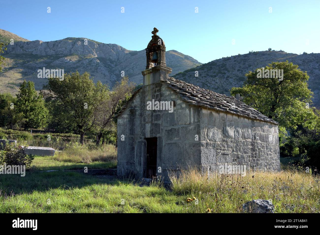 small stone church built with large tombstones called 'stecci' in ...