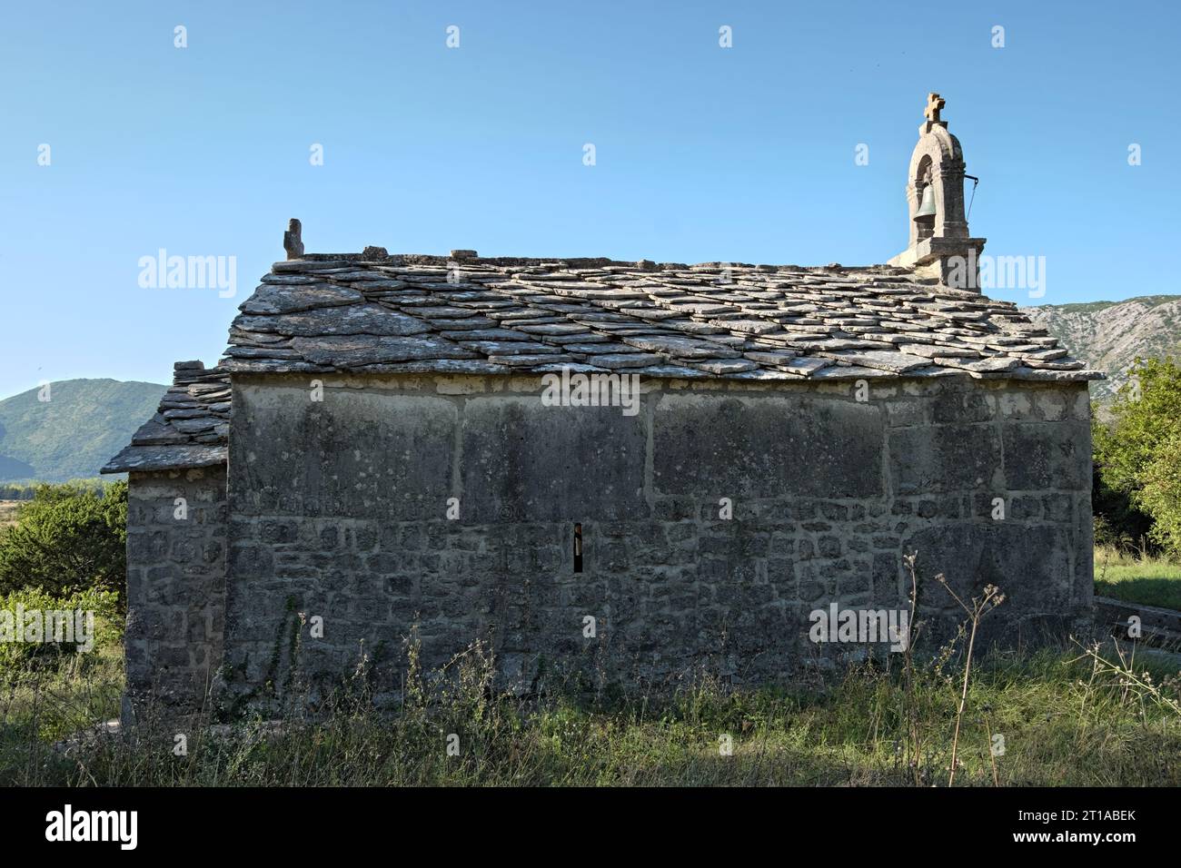 small stone church built with large tombstones called 'stecci' in ...