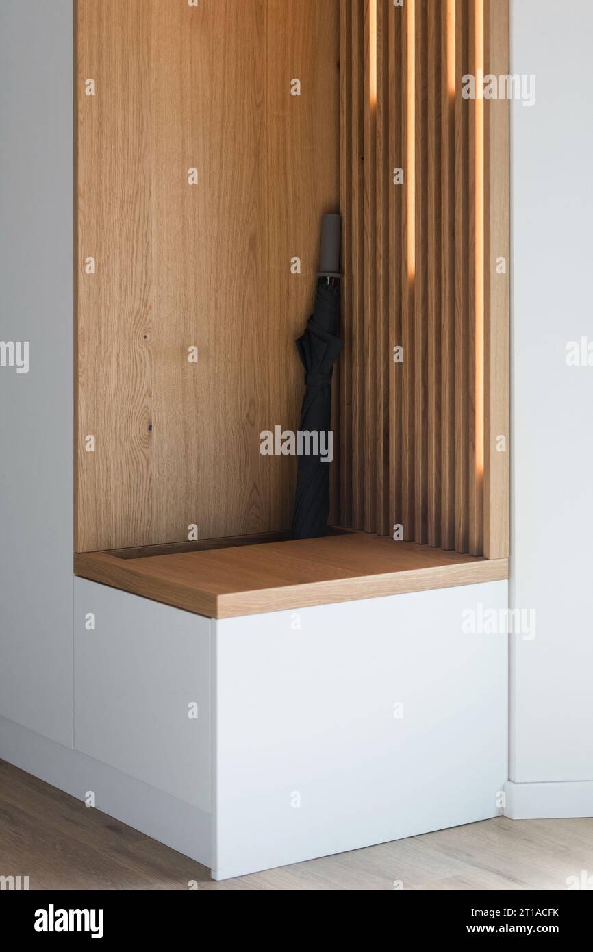 Sitting place in the corner of hall with wooden brown slats, modern ...