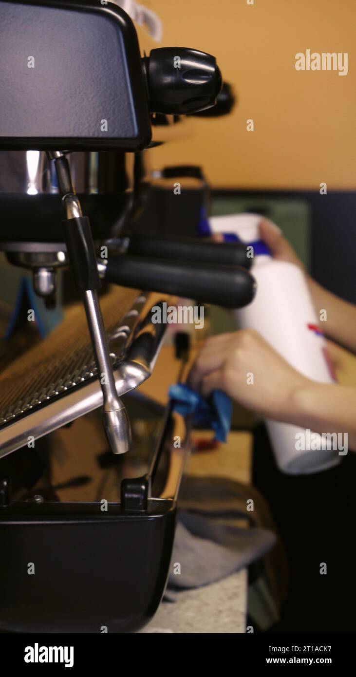 Blowing the steam tube of the coffee maker. Disinfection of dishes with ...