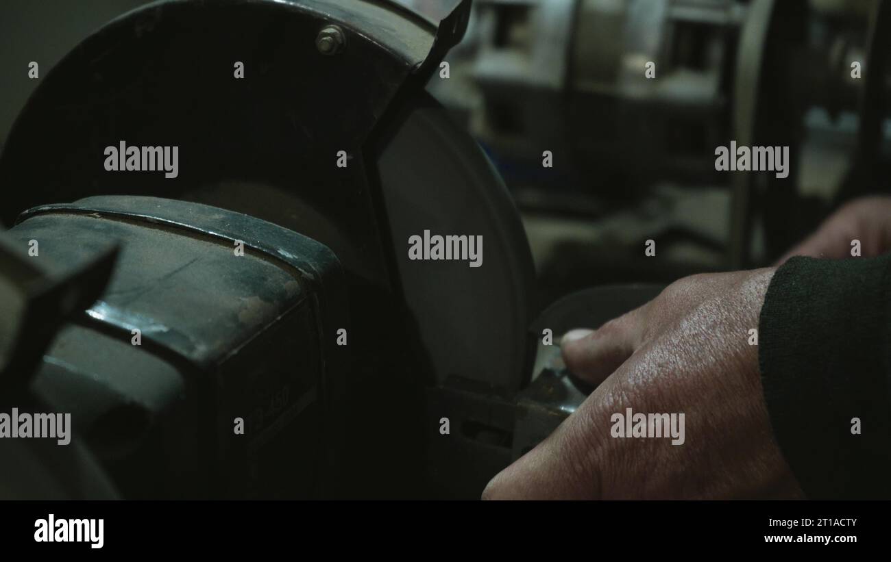 Grinding work with smooth equipment for steel metal, iron. Close-up of ...