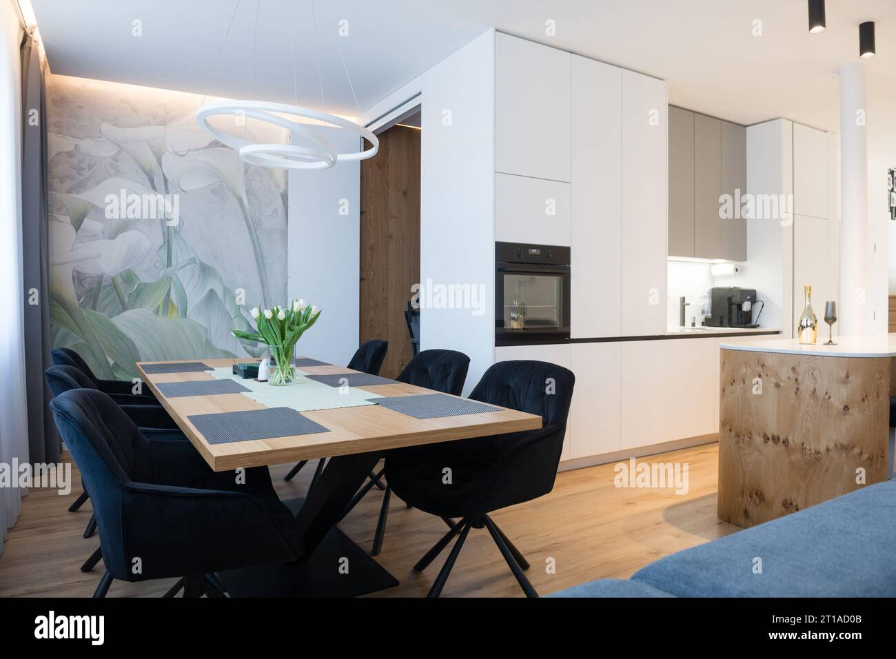 Dining table in the living room of modern house Stock Photo - Alamy