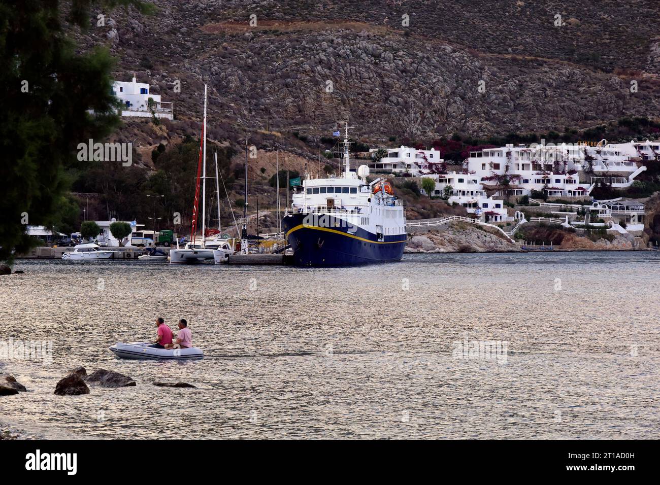 The Monet ship at Livadia harbour, and two men in a rubber dingy ...