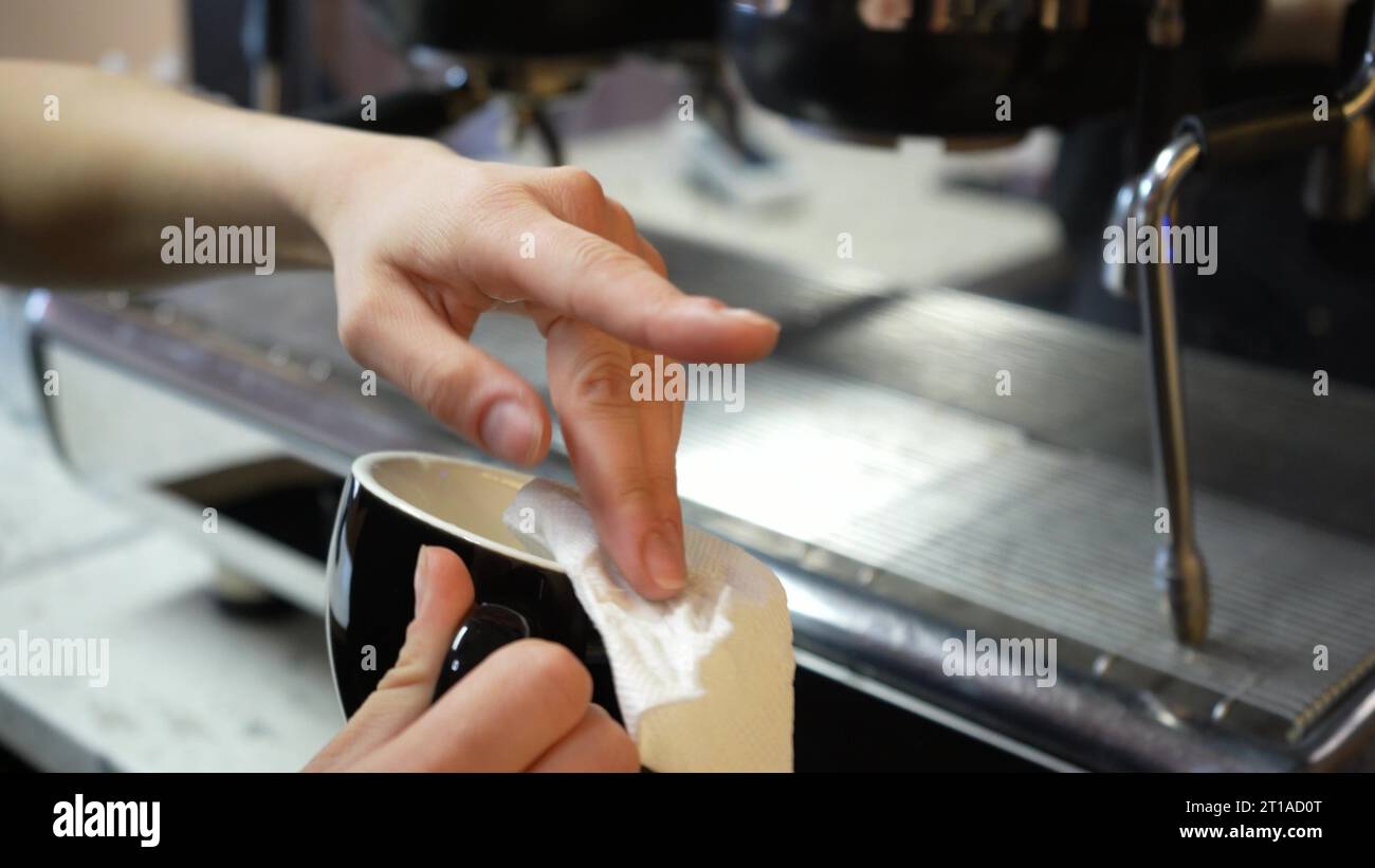 Blowing the steam tube of the coffee maker. Disinfection of dishes with ...