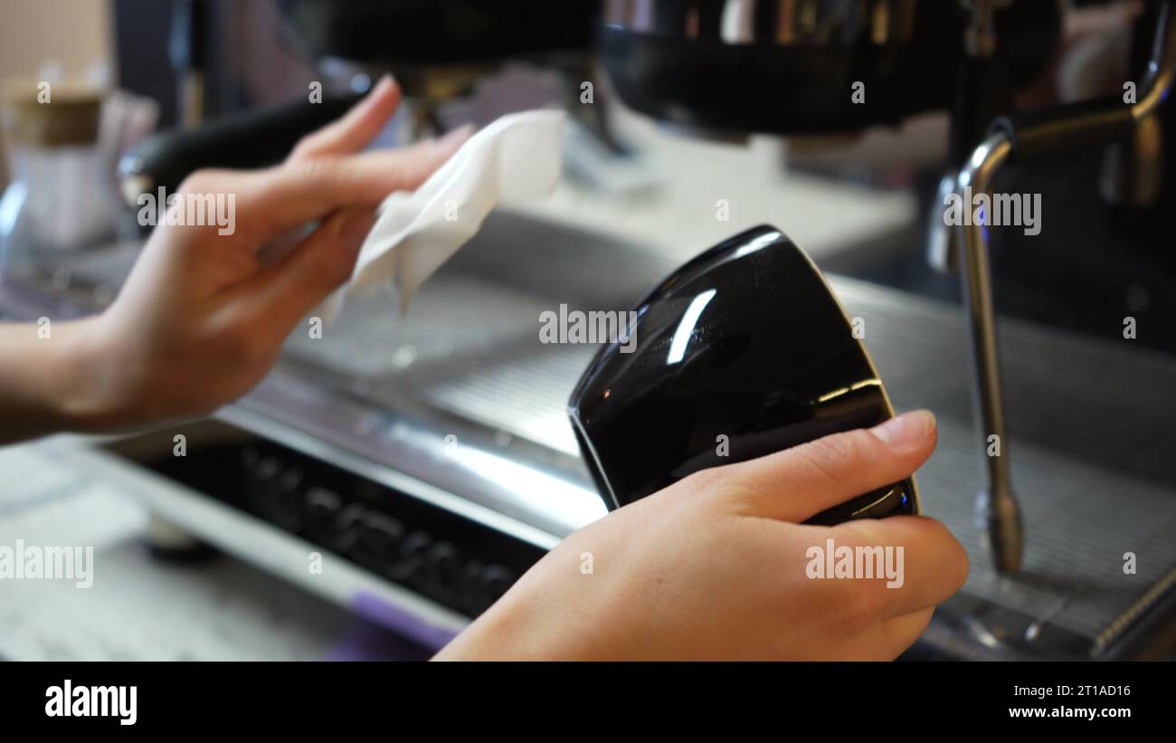 Blowing the steam tube of the coffee maker. Disinfection of dishes with ...