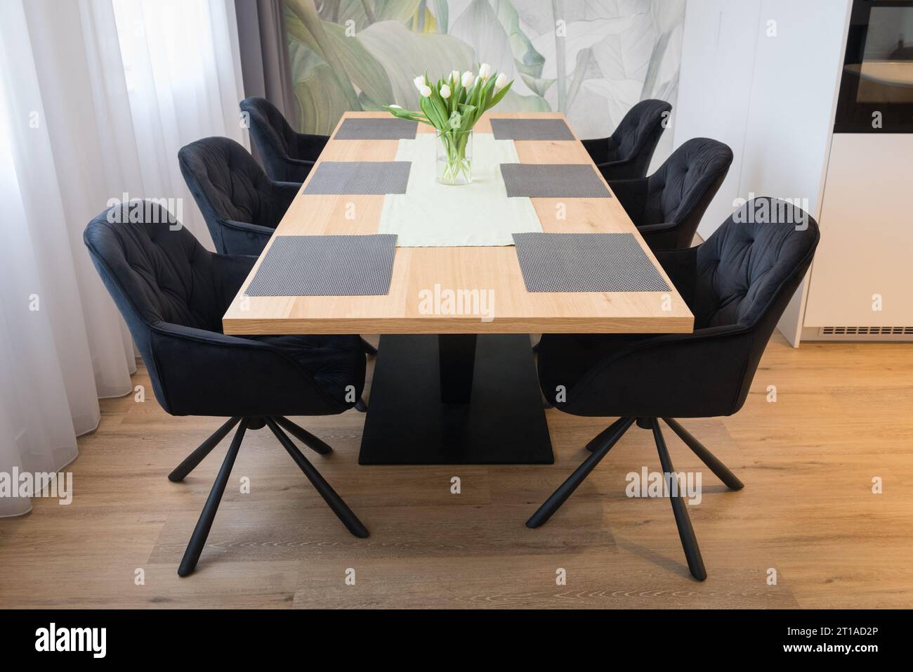 Dining table in the living room of modern house Stock Photo - Alamy
