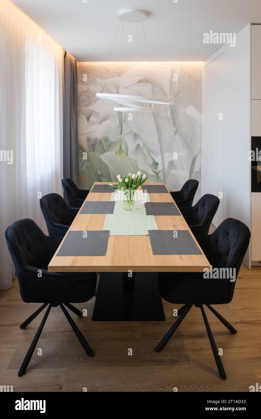 Dining table in the living room of modern house Stock Photo - Alamy