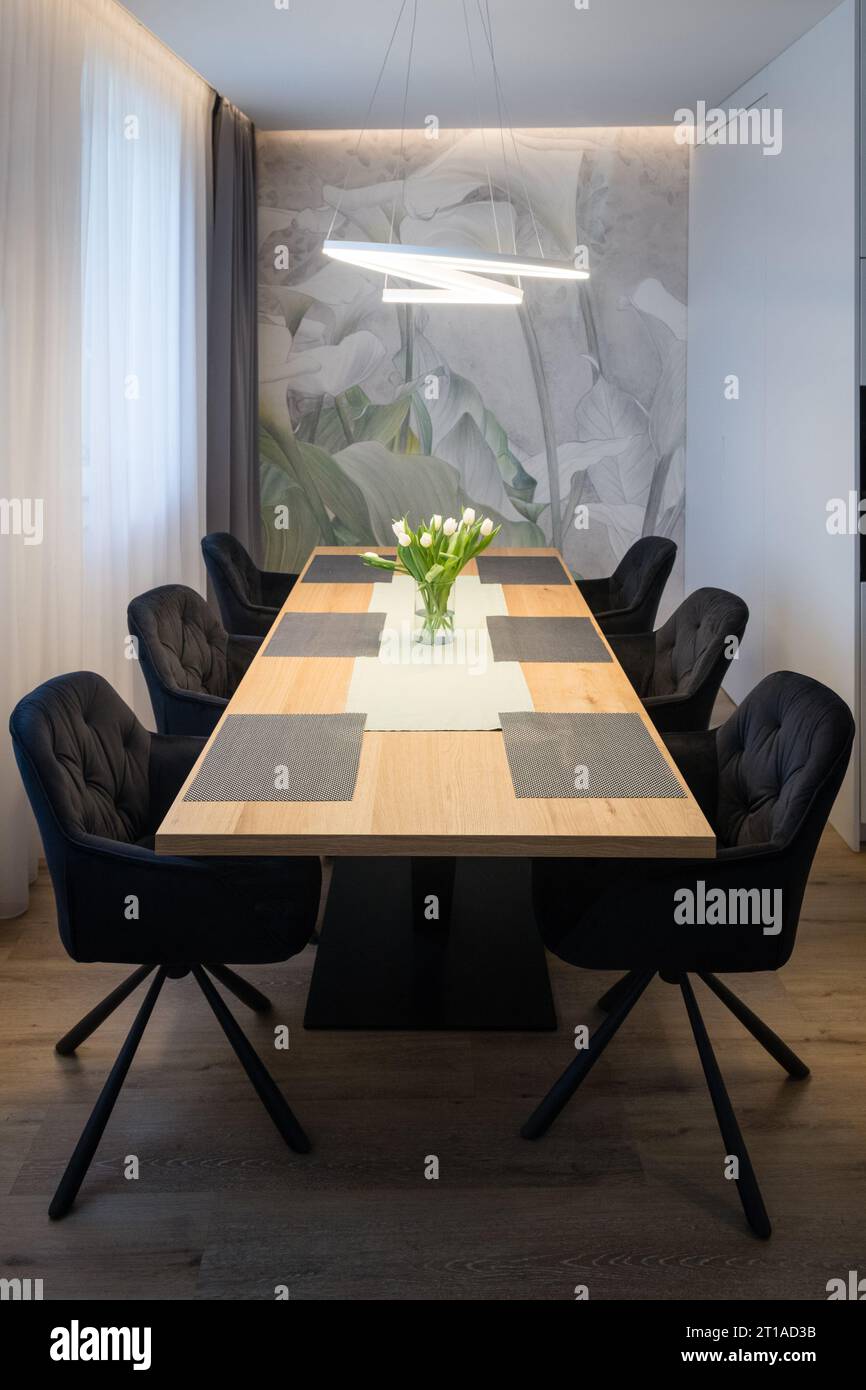 Dining table in the living room of modern house Stock Photo - Alamy
