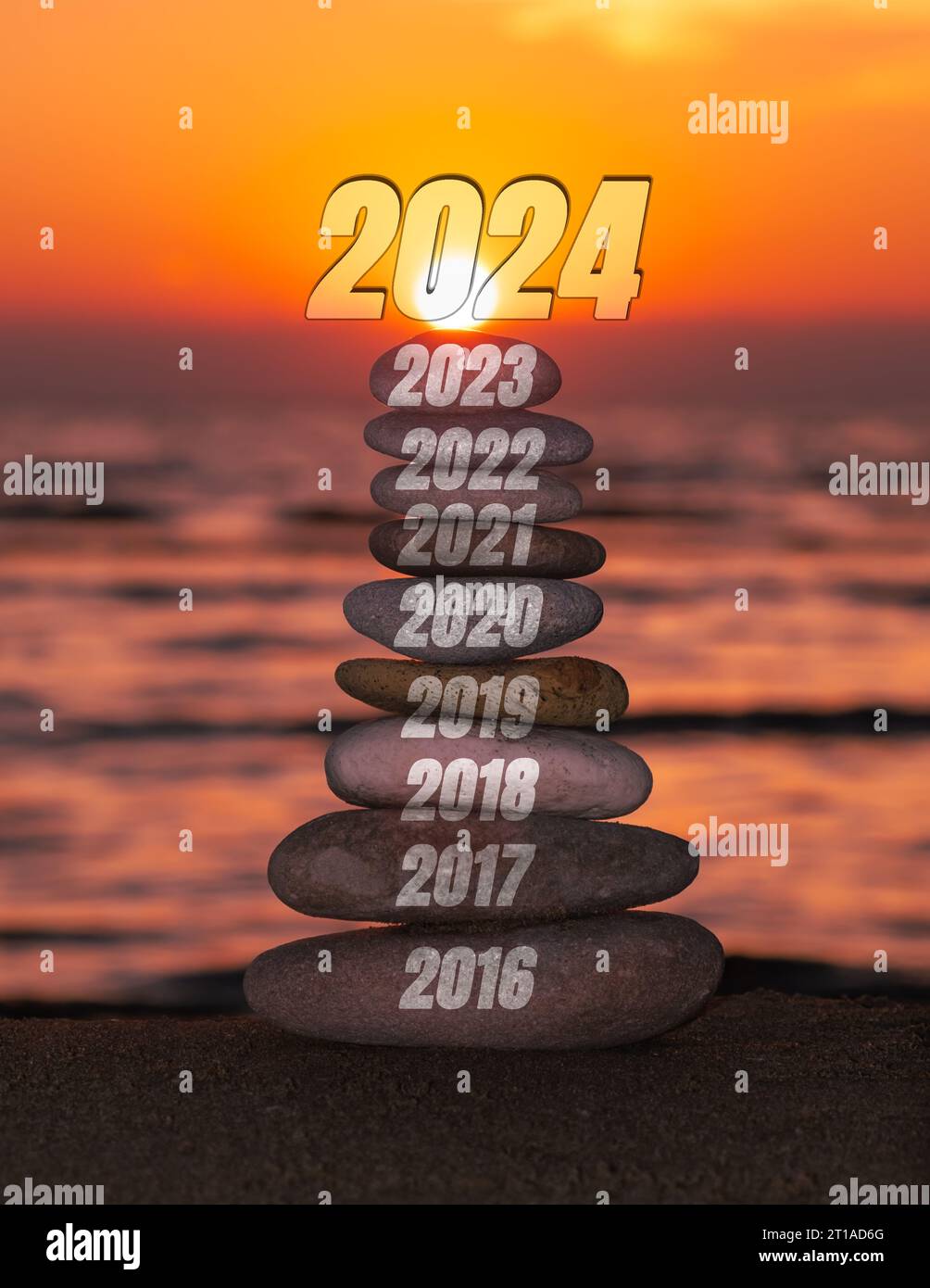 Vertical İmage of a pyramid of pebbles on the beach at sunset. Concept ...