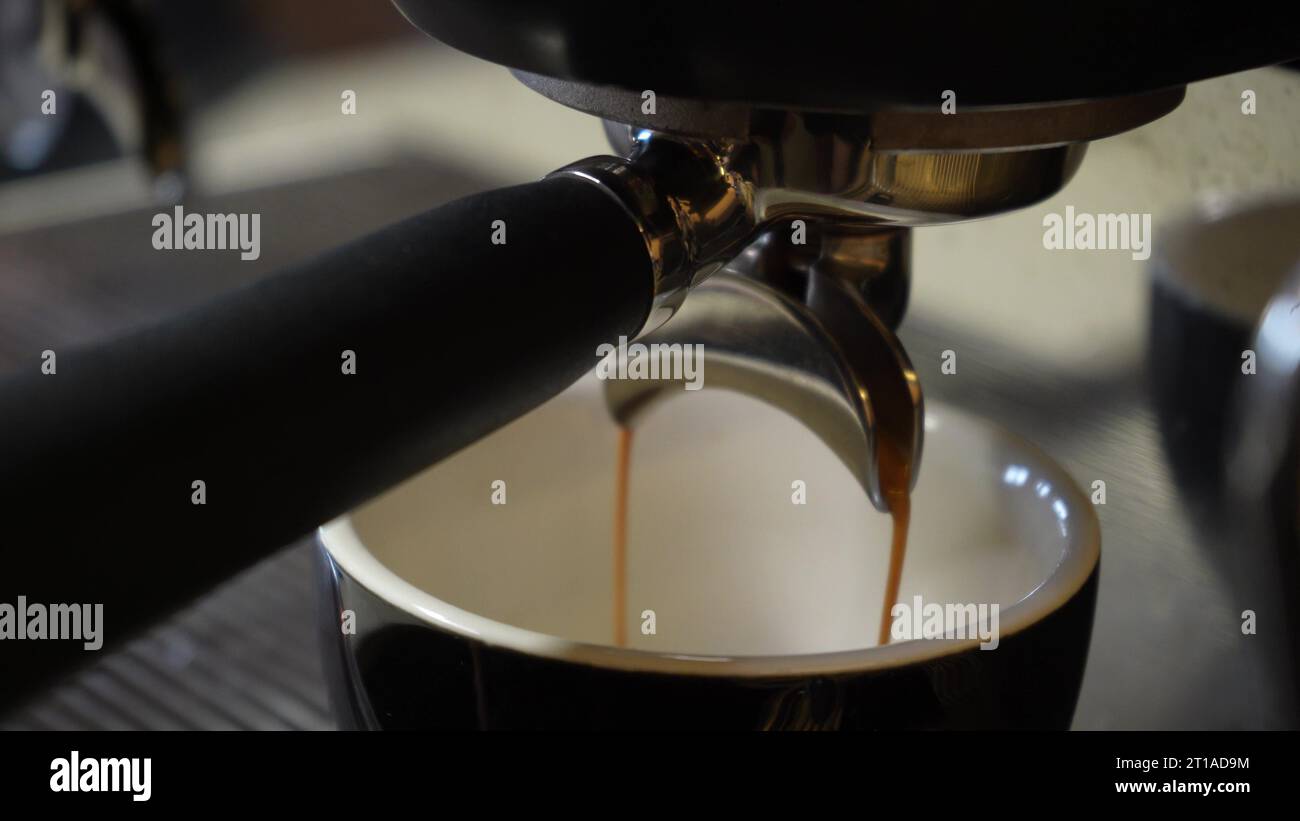 Video coffee flows from the machine into the cup. Homemade hot espresso ...