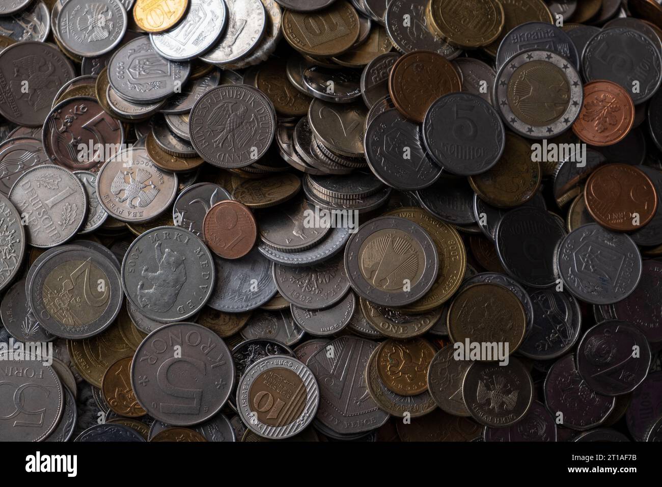 A heap of various money coins of different denominations from different ...