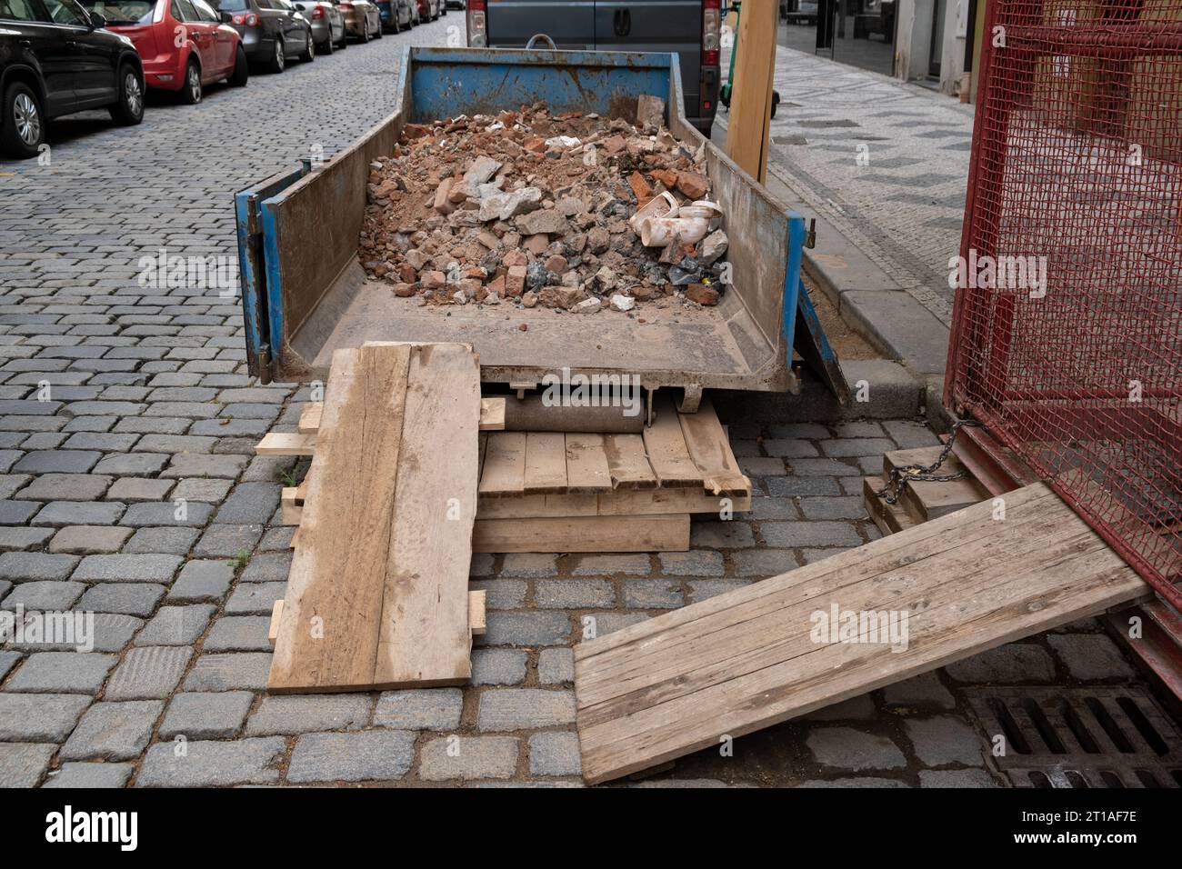 Metal dumpster waste container filled with construction waste and ...