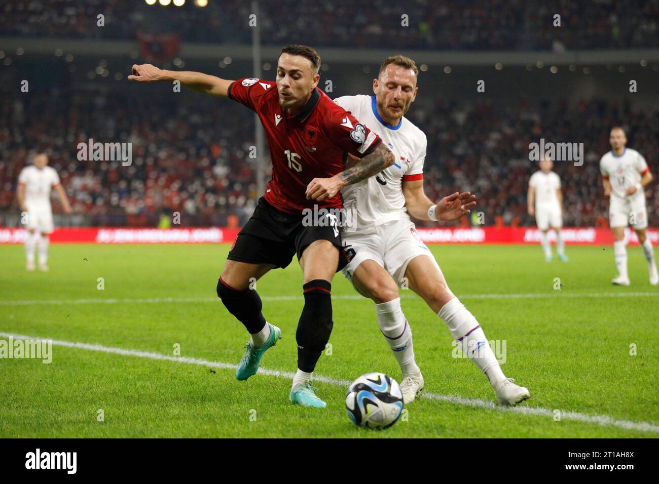 Albania's Taulant Seferi, left, challenges for the ball with Czech ...