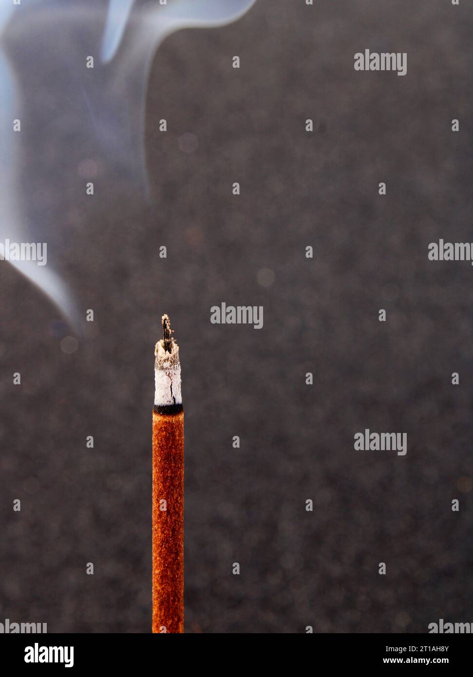 Incense lit with ash and smoke Stock Photo - Alamy