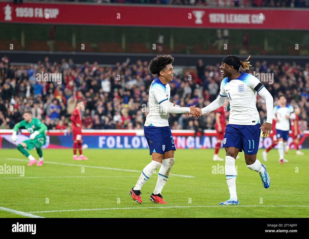 England's Rico Lewis (left) and England's Noni Madueke celebrates ...