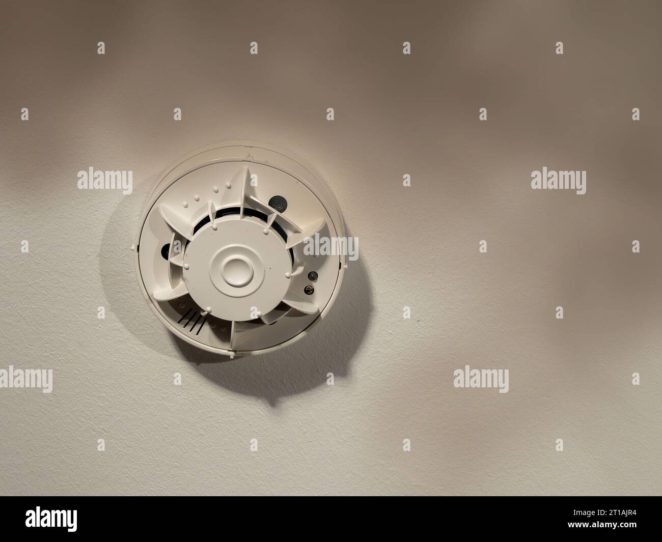 The smoke detector is installed on the ceiling and smoke rises ...