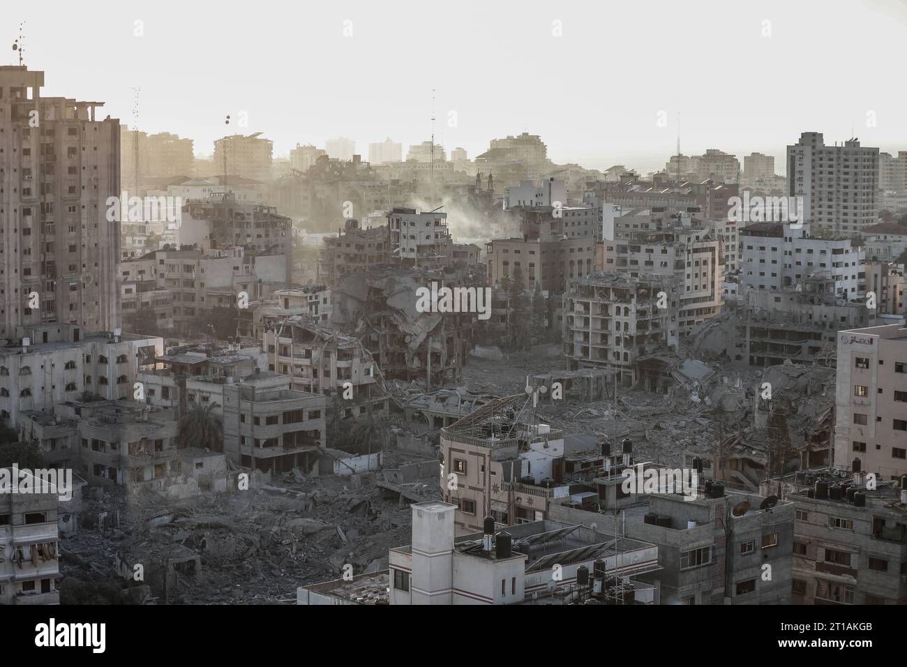 A view of ruins and demolished buildings following Israeli air strikes ...