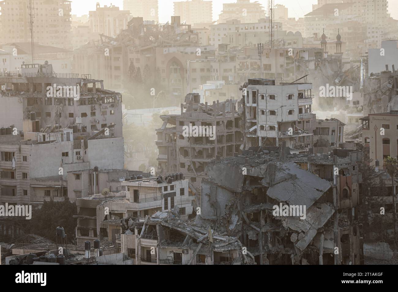A view of ruins and demolished buildings following Israeli air strikes ...