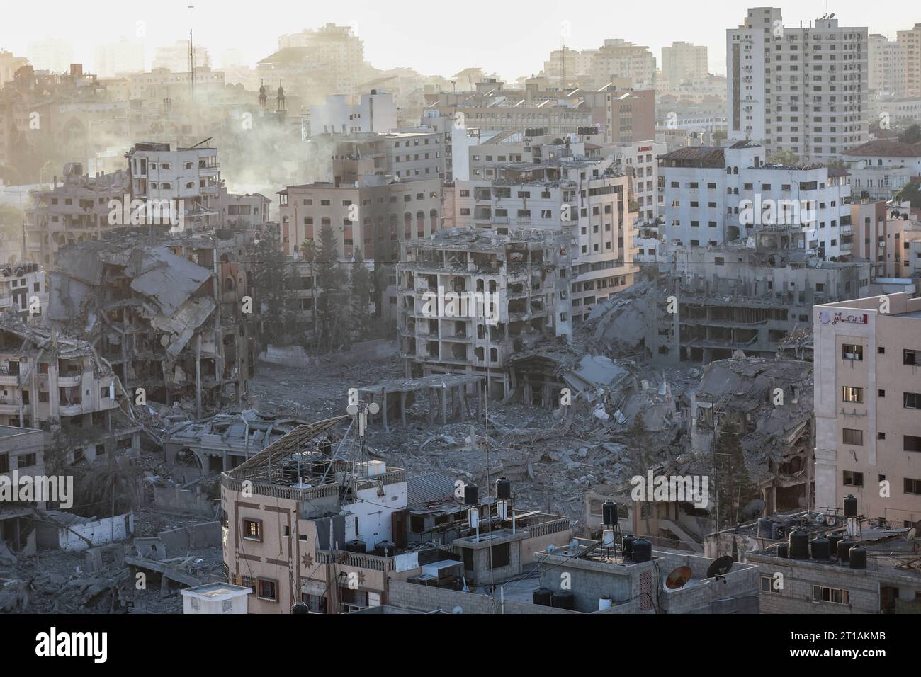 A view of ruins and demolished buildings following Israeli air strikes ...