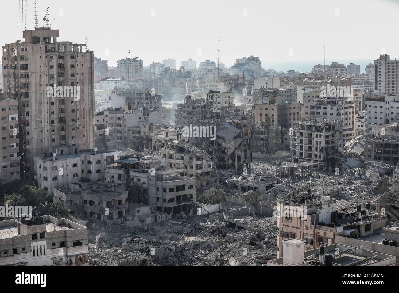 A view of ruins and demolished buildings following Israeli air strikes ...