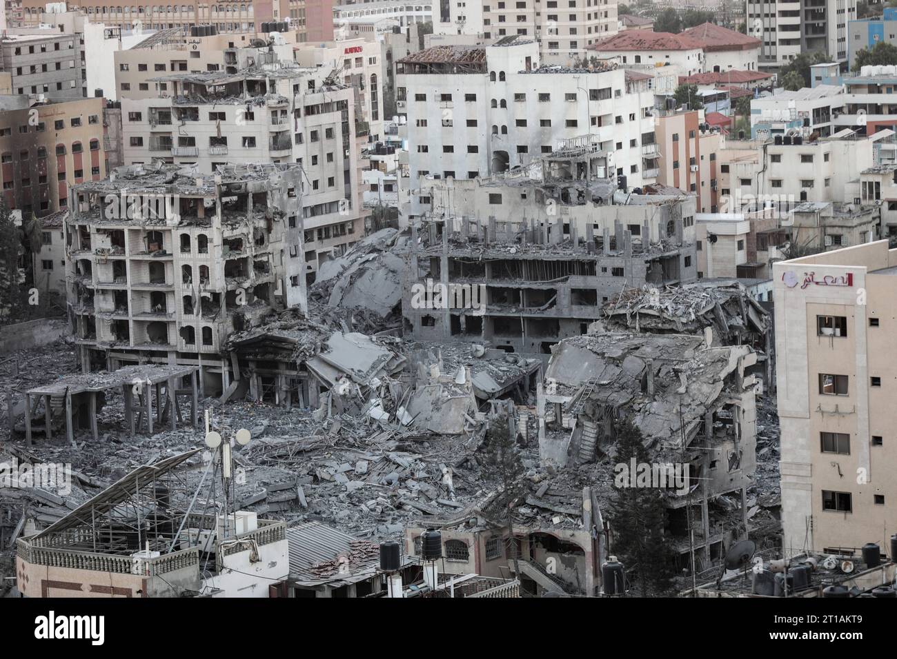 A view of ruins and demolished buildings following Israeli air strikes ...