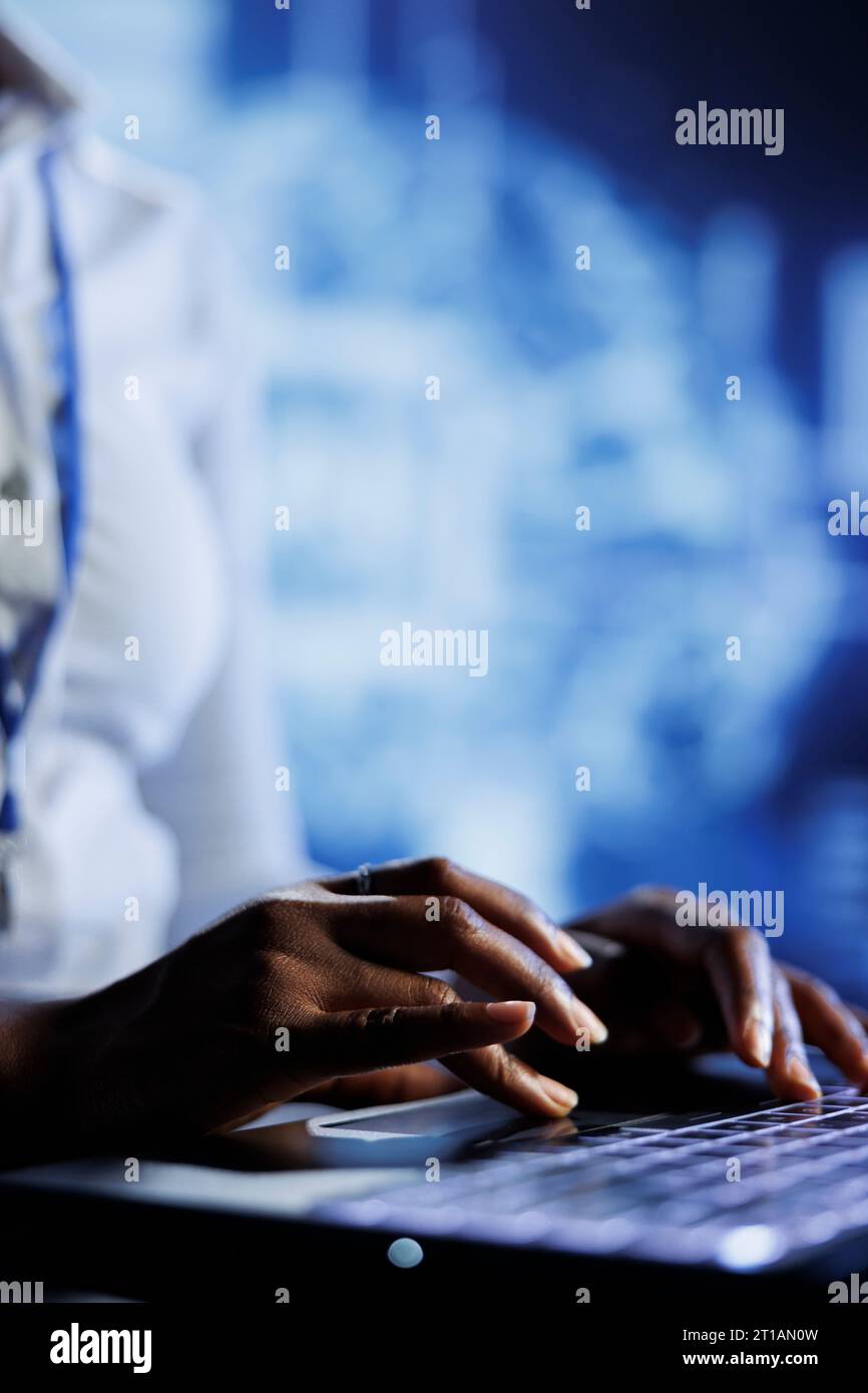 Computer operator uses laptop to develop artificial intelligence neural ...