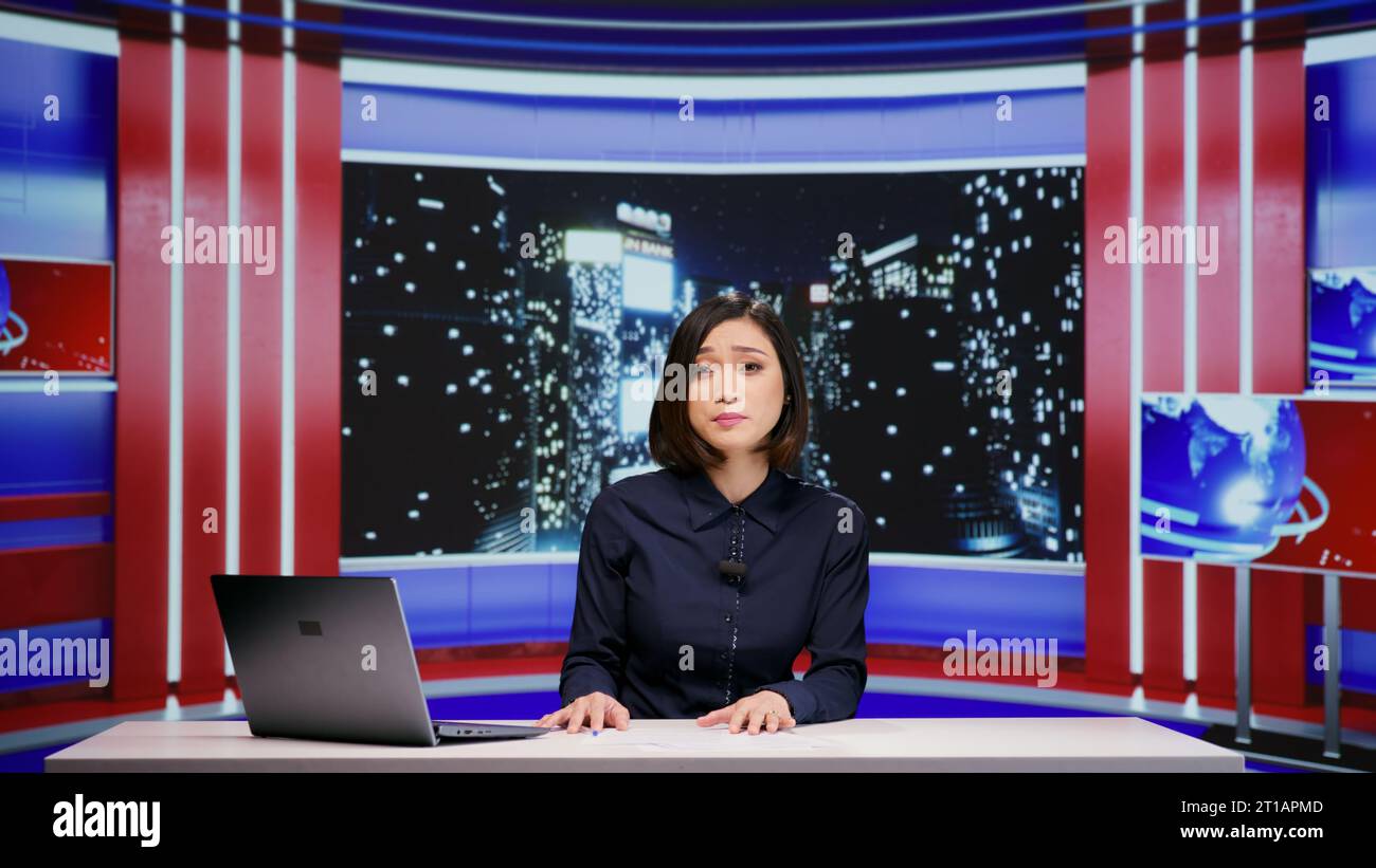 Asian news anchor hosting live broadcast to discuss about new ...