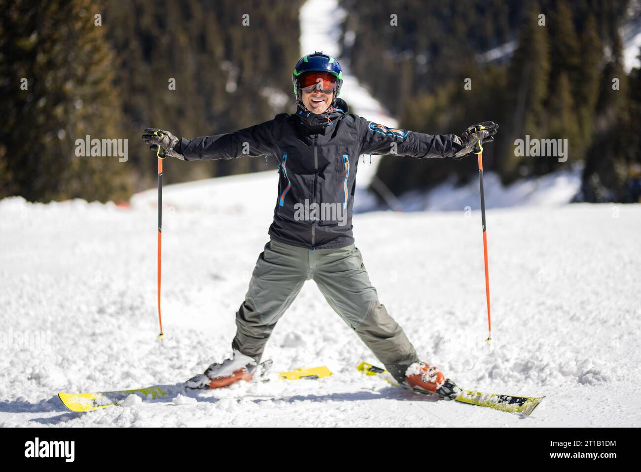 Male skier standing on slope hi-res stock photography and images - Alamy