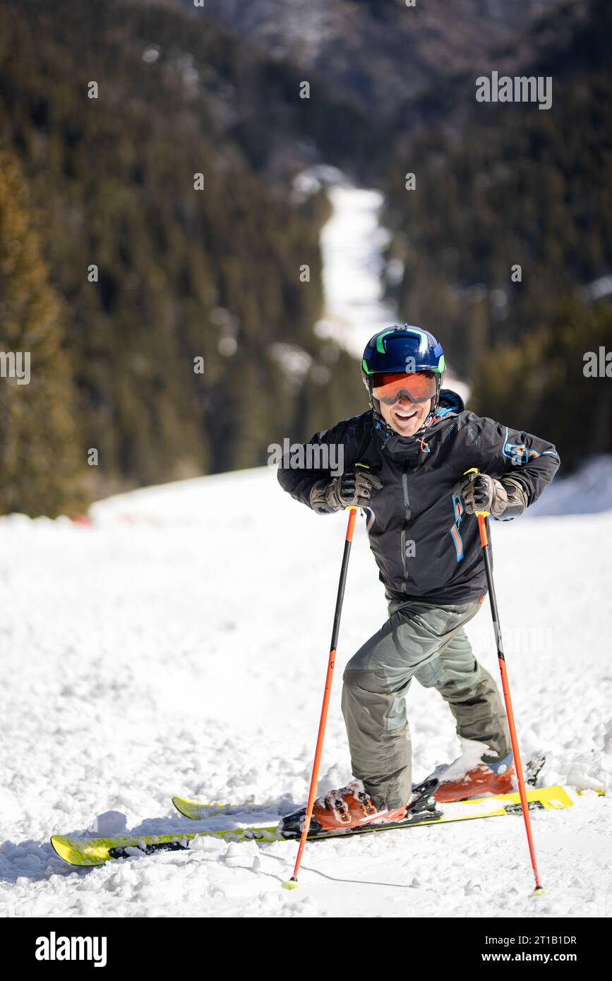 Male skier standing on slope hi-res stock photography and images - Alamy