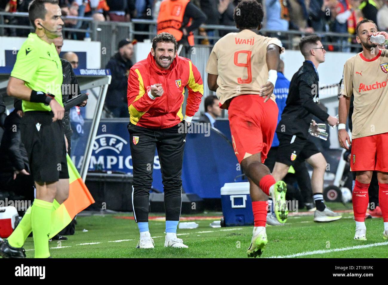 Elye Wahi (9) of RC Lens celebrating with Jean-Louis Leca (16) of RC ...