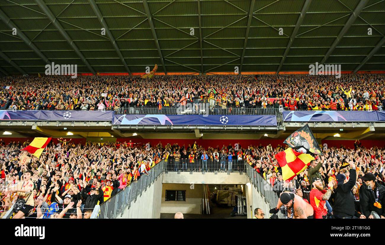 fans and supporters of Lens in tribune Delacourt celebrating after ...