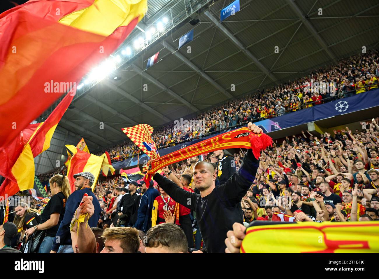 fans and supporters of Lens in tribune Marek and Xerces celebrating ...