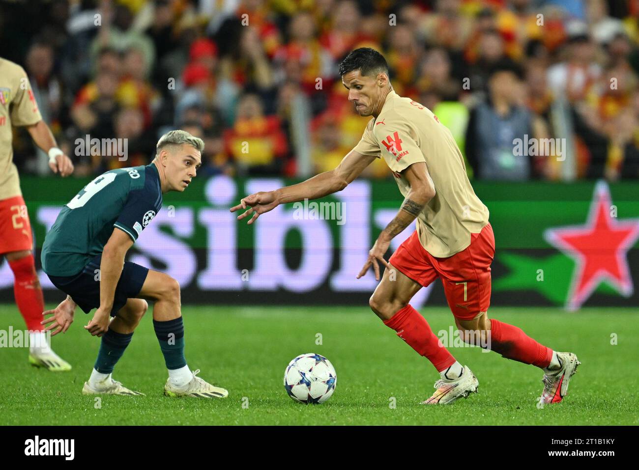 Leandro Trossard (19) of Arsenal defending on Florian Sotoca (7) of RC ...