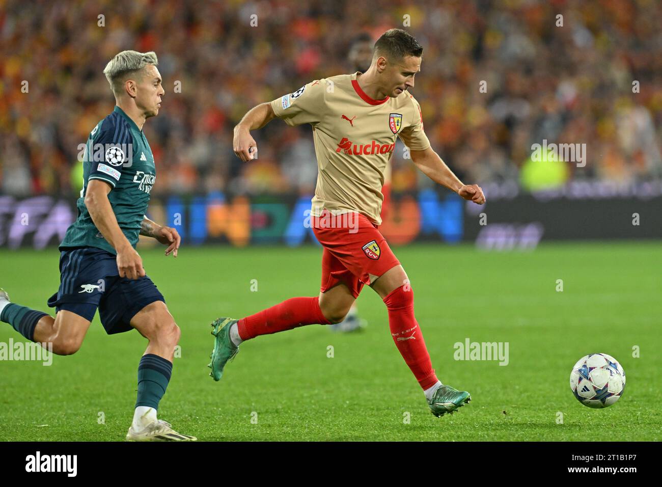 Leandro Trossard (19) of Arsenal defending on Przemyslaw Frankowski (29 ...