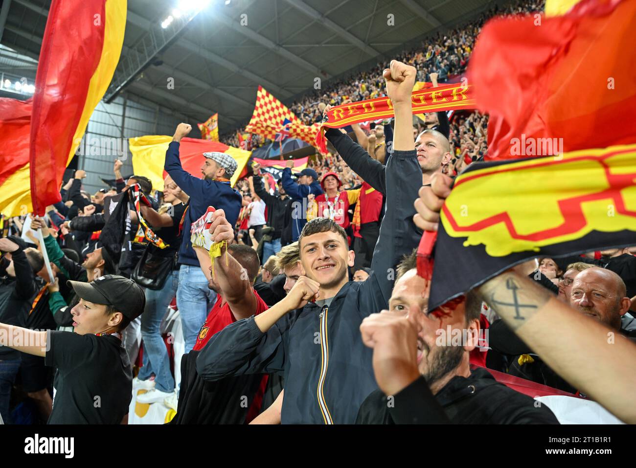 fans and supporters of Lens in tribune Marek and Xerces celebrating ...