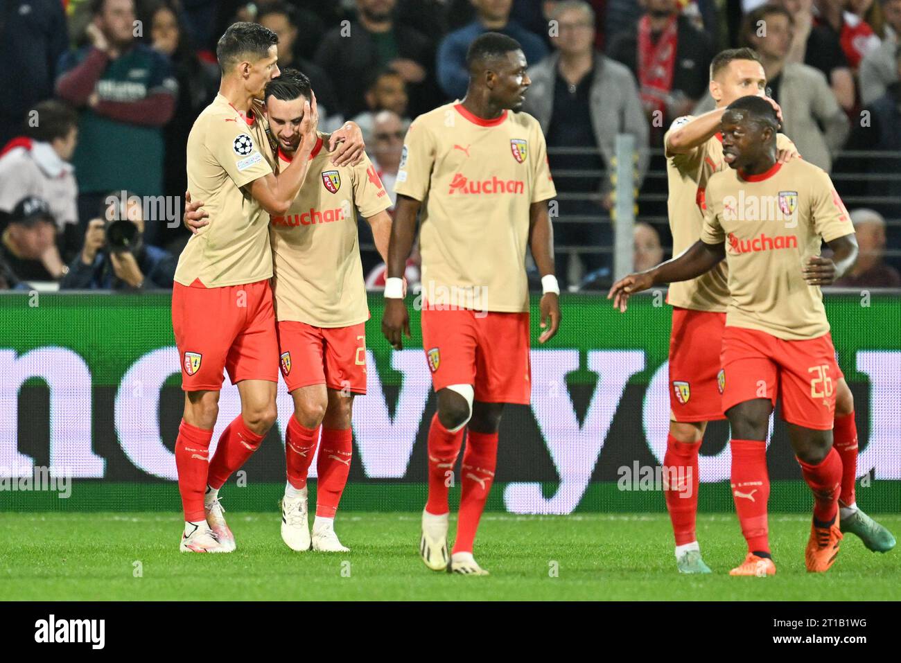 players of RC Lens celebrate Adrien Thomasson (28) of RC Lens scoring ...
