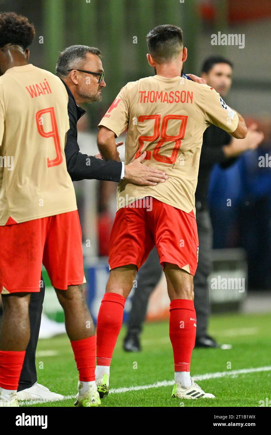 Adrien Thomasson (28) of RC Lens celebrates with Head Coach Franck ...